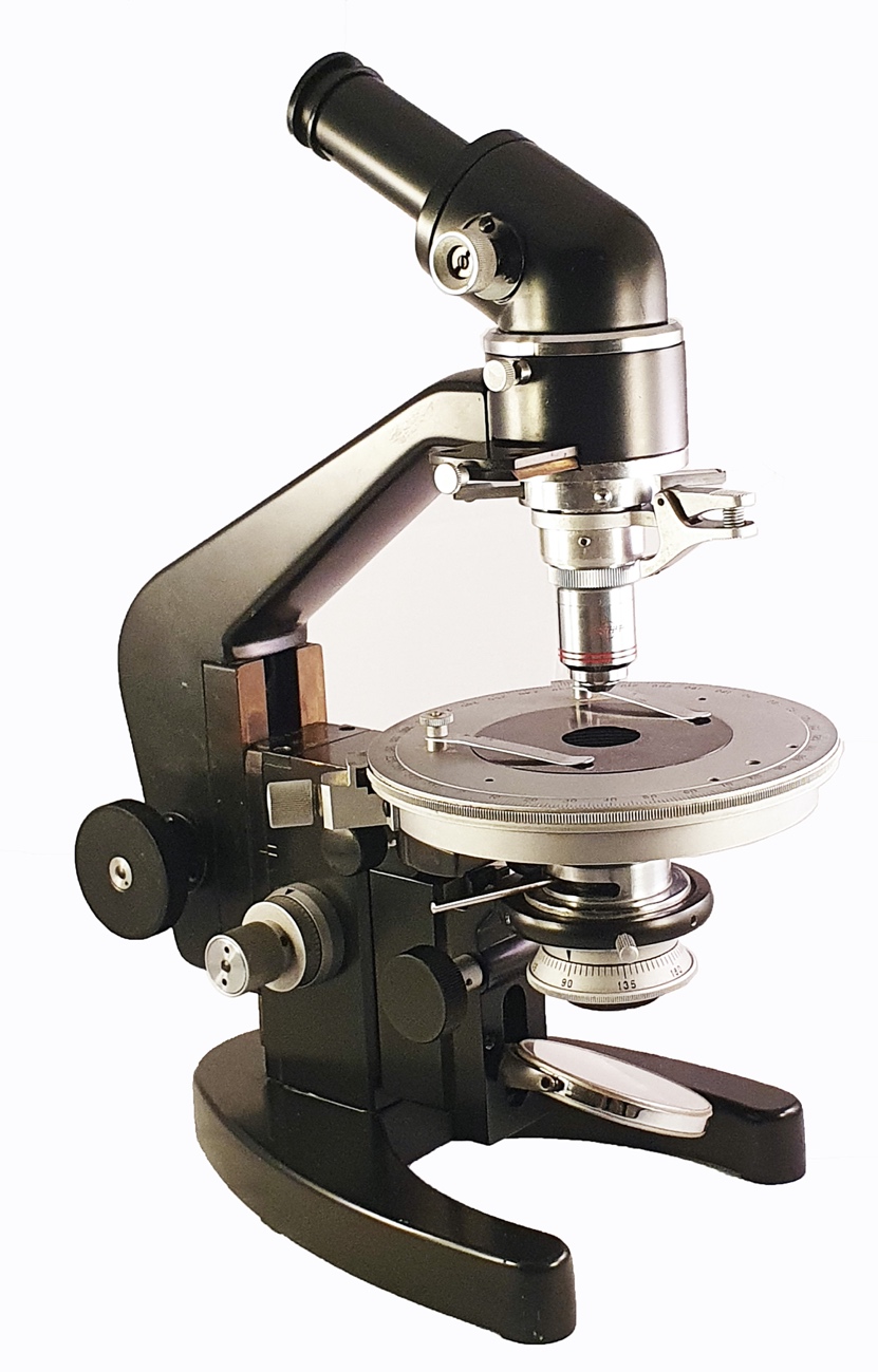 A close-up of a microscopeDescription automatically generated with ...