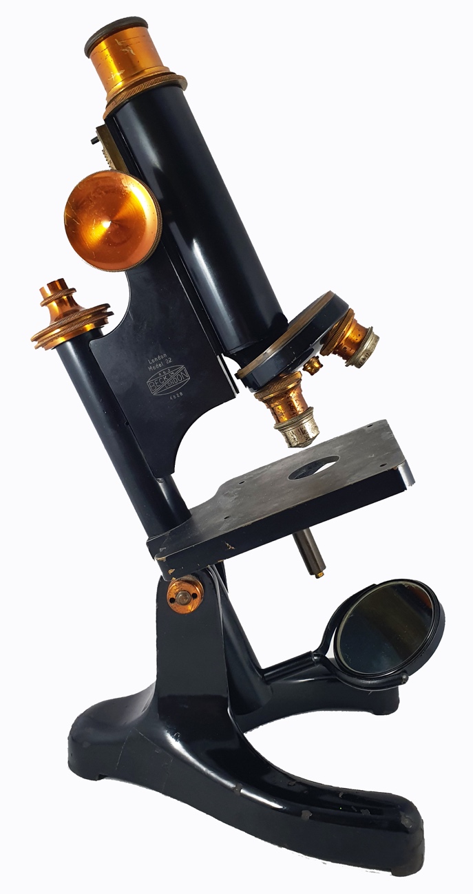 A picture containing black, table, front, sittingDescription ...